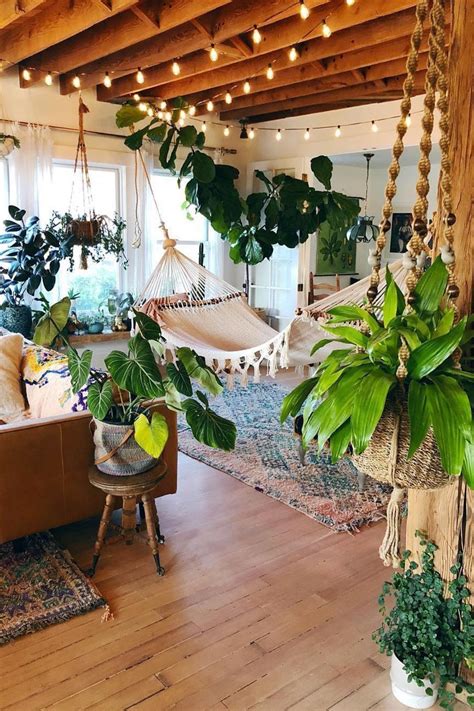 A Living Room Filled With Furniture And Lots Of Plants On The Wall Next