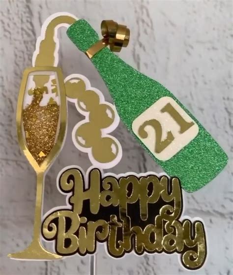 A Happy Birthday Cake Topper With A Champagne Glass