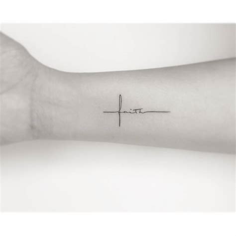 Faith Cross Tattoo Located On The Inner Forearm