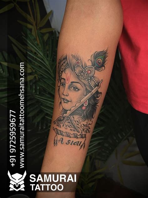 A Woman With A Tattoo On Her Arm