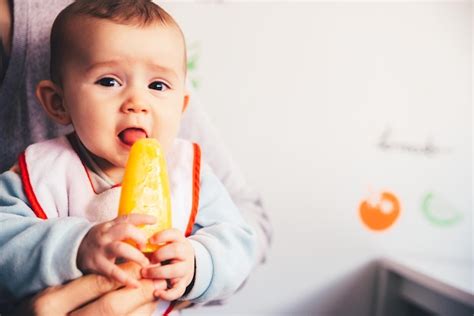 Premium Photo Portrait Of Cute Girl Licking Ice Cream