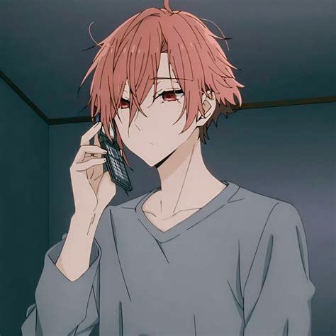 A Man With Pink Hair Is Talking On A Cell Phone And Holding His Hand Up