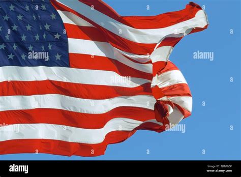American Flag Waving Proudly In The Wind Representing United States