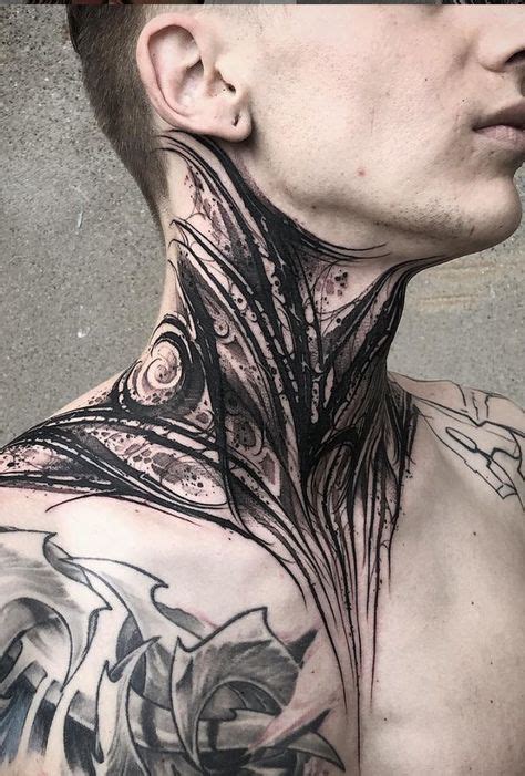 A Man With Tattoos On His Neck And Chest