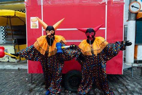 Two People In Costume Pose For A Photo At The Carnival Editorial Image