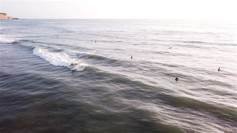 Premium Stock Video Surfing At Olon Beach Ecuador Tourists Having