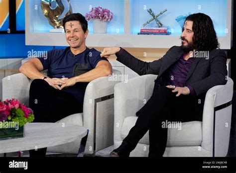 Mark Wahlberg Left And Jonathan Roumie Bear A Cross Of Ashes On Their