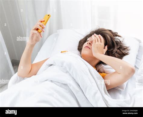 Sleepy Woman Looks On Smartphone Screen Checking E Mail Box Right