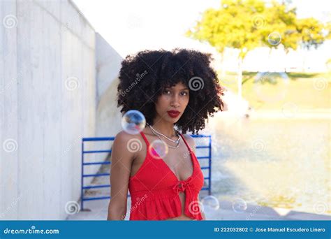 Beautiful Afro American Woman Playing With Soap Bubbles The Woman Is Blowing The Bubbles And