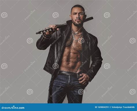 Handsome Serious Man Stands In Side Plank Has Perfect Body