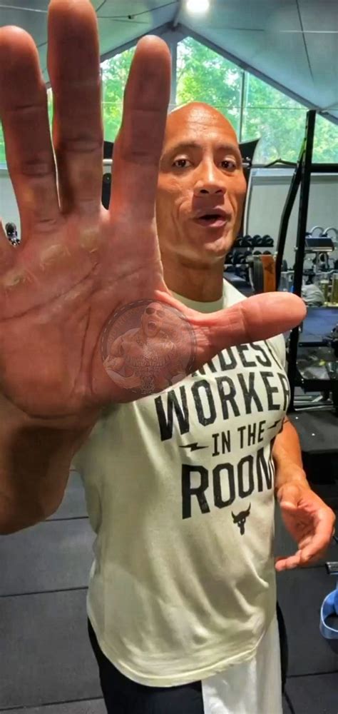 A Man Holding His Hand Up In The Air