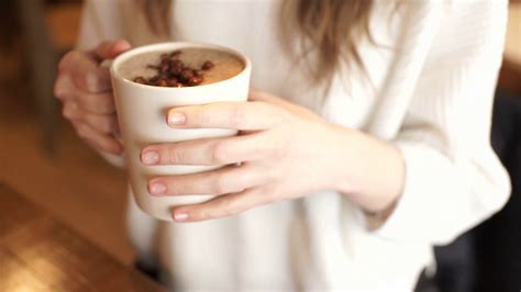 Closeup Of Female Hands Holding A Cup Of Coffee Close Up Of Female