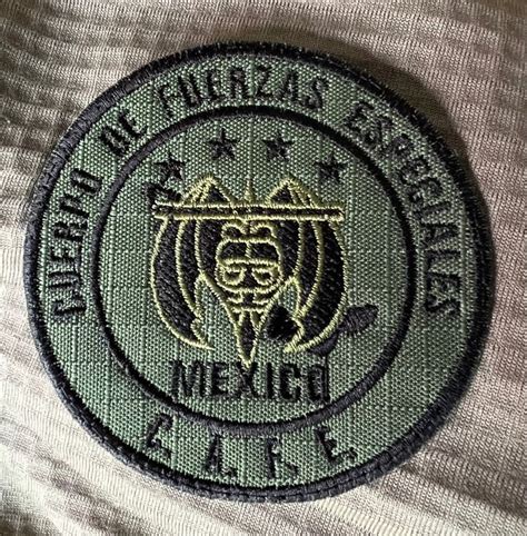 The Mexican Army Emblem On A White Shirt