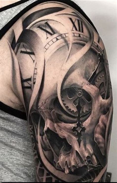 A Man With A Clock And Skull Tattoo On His Arm