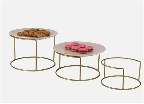 Three Tables With Different Types Of Pastries On Them