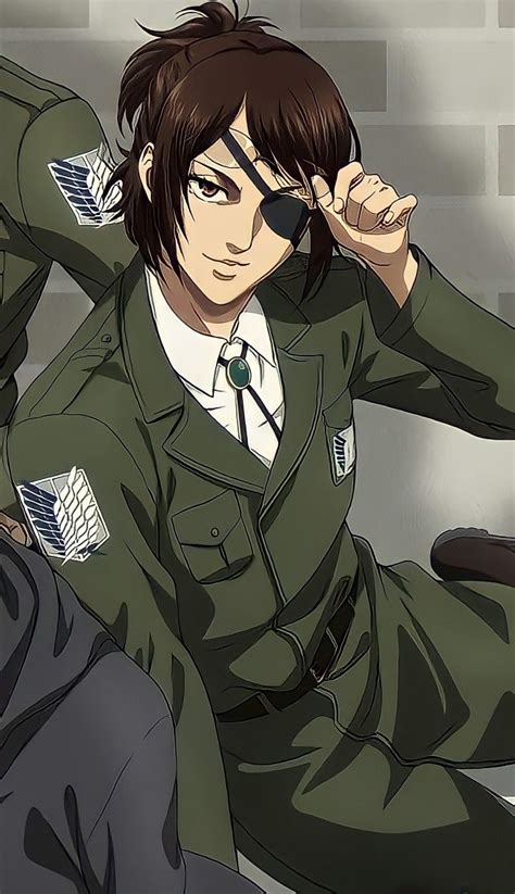 A Man In Uniform Sitting Down With His Hand On His Head
