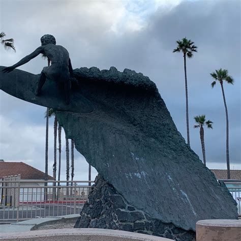 Naked Surfer Statue In Huntington Beach Ca Photos