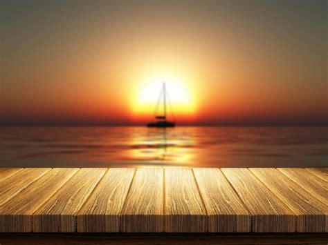 Barco à vela no meio do sol ao pôr do sol Foto Grátis
