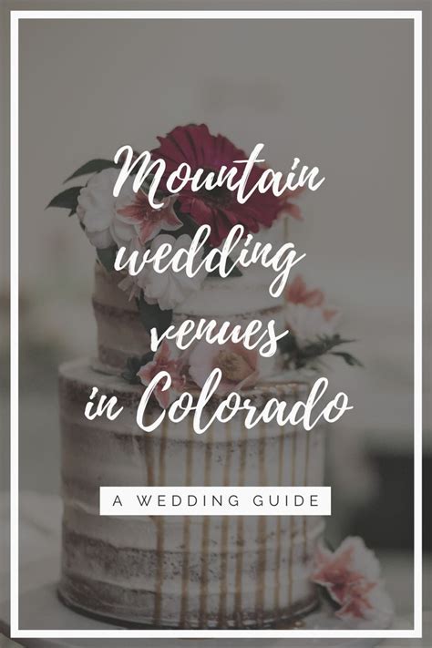 A Wedding Cake With Flowers On Top And The Words Mountain Wedding Venue
