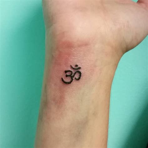 Totally Zen Yoga Tattoos To Keep You Centered Brit Co Om