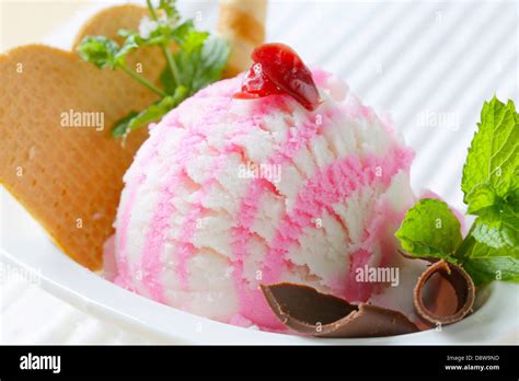 Scoop Of Ice Cream Garnished With Wafers And Herbs Stock Photo Alamy