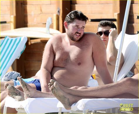 Patrick Schwarzenegger Looks Fit Going Shirtless At The Beach Photo