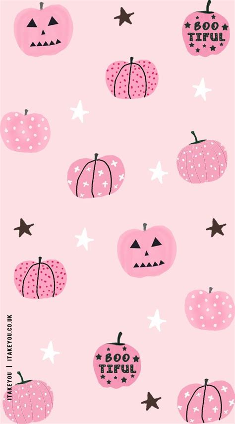 A Pink Background With Pumpkins And Stars On It