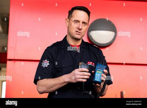 A London Fire Brigade Firefighter Operates New Communication Apparatus