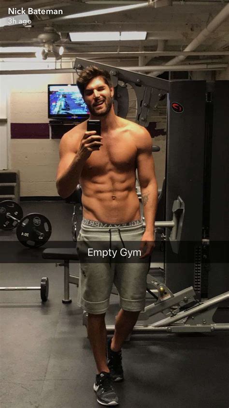 A Shirtless Man Is Taking A Selfie In The Gym With His Cell Phone