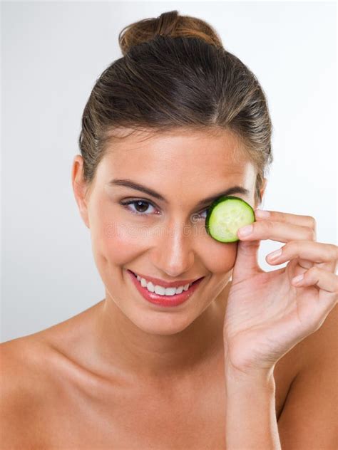 You Wont Catch Me With Bags Under My Eyes Portrait Of A Gorgeous Young Woman Holding A Slice Of