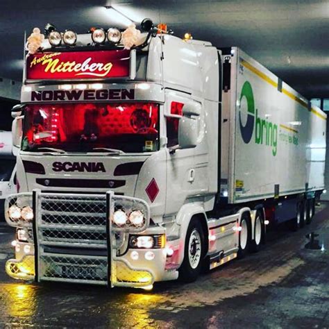 A Large Semi Truck Parked In A Parking Garage