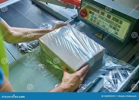 Experienced Operator Packing Goods Using The Packaging Machinery Stock