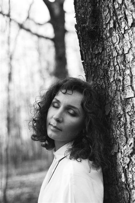 A Beautiful Woman Dreaming In A Forest By Stocksy Contributor Anna