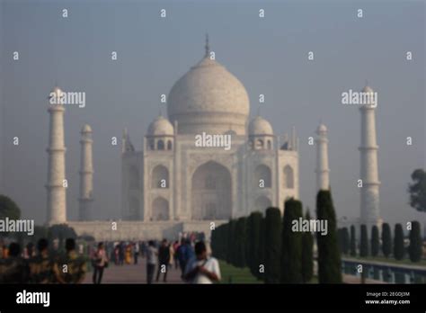 The Taj Mahal Is An Ivory White Marble Mausoleum On The South Bank Of