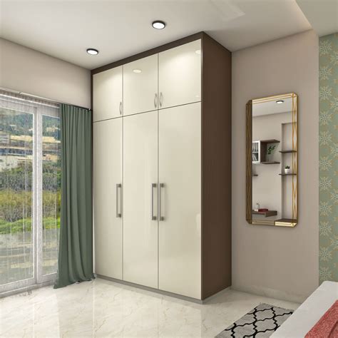 Compact Swing Wardrobe Design With Lofts Livspace