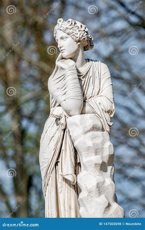 Ancient Statue Covered With Moss And Lichen Of A Sensual Renaissance