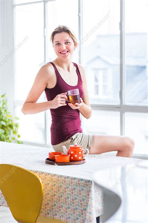 Woman Drinking Hot Beverage Stock Image C035 1992 Science Photo