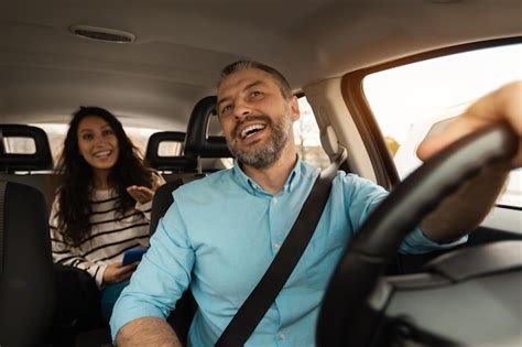 Premium Photo Portrait Of Happy Male Driver Riding Car With Passenger