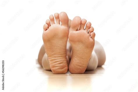 Naked Woman Lying On The Floor With A Focus On Feet Stock Photo Adobe