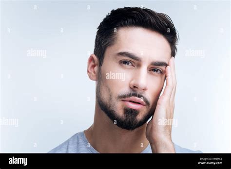 Tired Man Touching His Head While Having A Headache Stock Photo Alamy