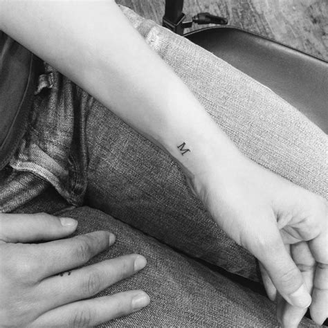 Minimalistic Style Letter M Tattoo Located On The