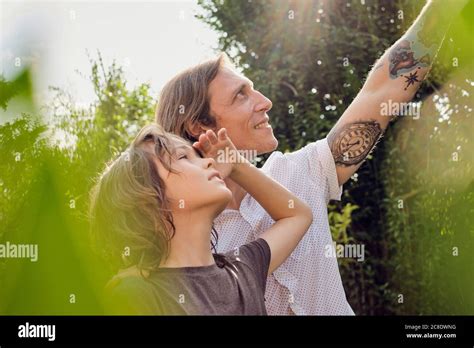 Son Showing Something To His Father Hi Res Stock Photography And Images