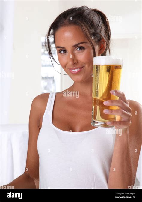 WOMAN HOLDING GLASS OF BEER Stock Photo Alamy