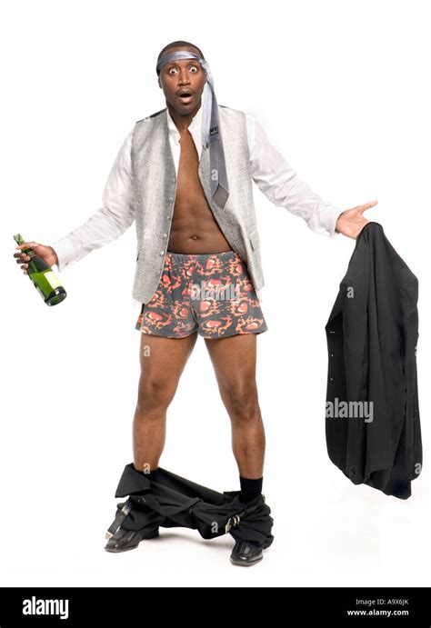Humorous Image Of A Young Drunk Man With An Empty Bottle And His Trousers Pants Around His