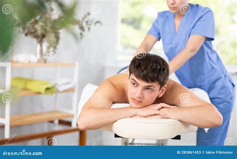 Masseuse Doing Back Massage To Young Guy Stock Image Image Of Relaxing Profession 285861453