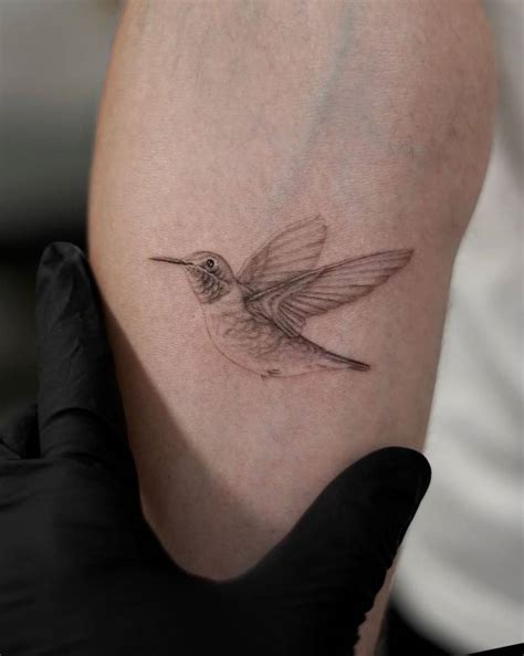 Micro Realistic Style Hummingbird Tattoo Located On The