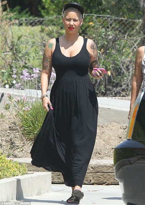 Amber Rose Shows Off Her Post Baby Curves In Black Dress As She Heads