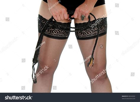 Sexy Woman In Thigh High Stockings Holding Bull Whip Stock Photo
