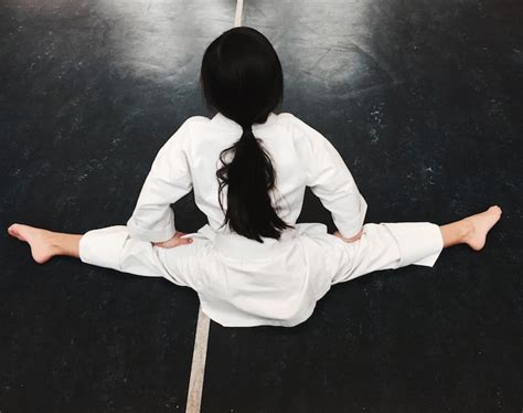 Premium Photo Rear View Of Girl Doing Splits In Class