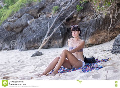 Pretty Woman Posing On The Beach Near The Ocean Of Tropical Island Bali Indonesia Stock Image